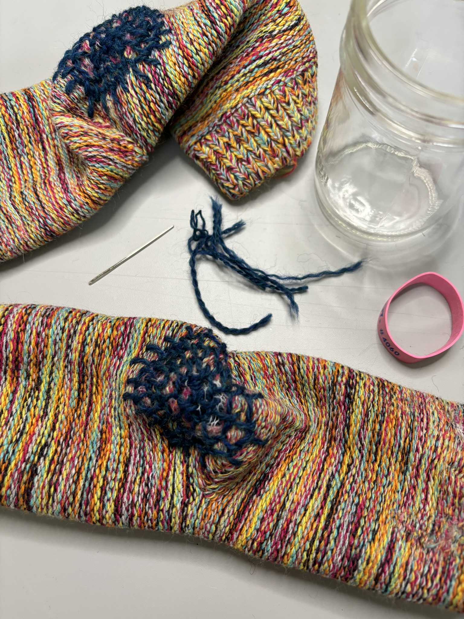 Sock mending using the honeycomb darn - Curious Crone